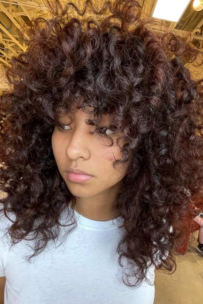 Implement Curly Bangs In Your Outlook and Enjoy The Flattering Effect