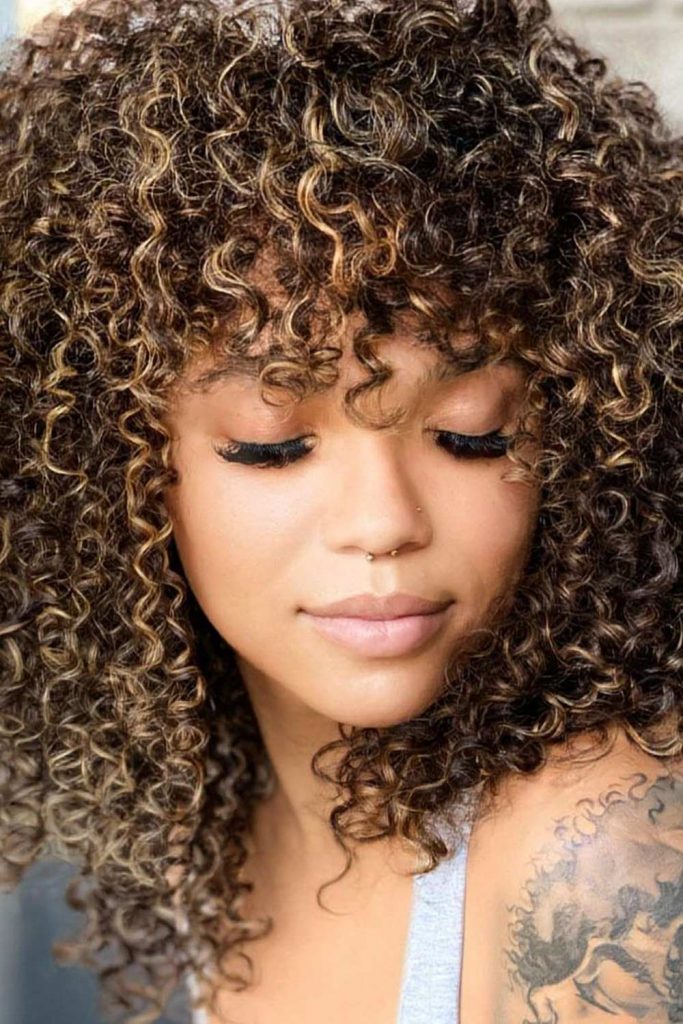 Implement Curly Bangs In Your Outlook and Enjoy The Flattering Effect